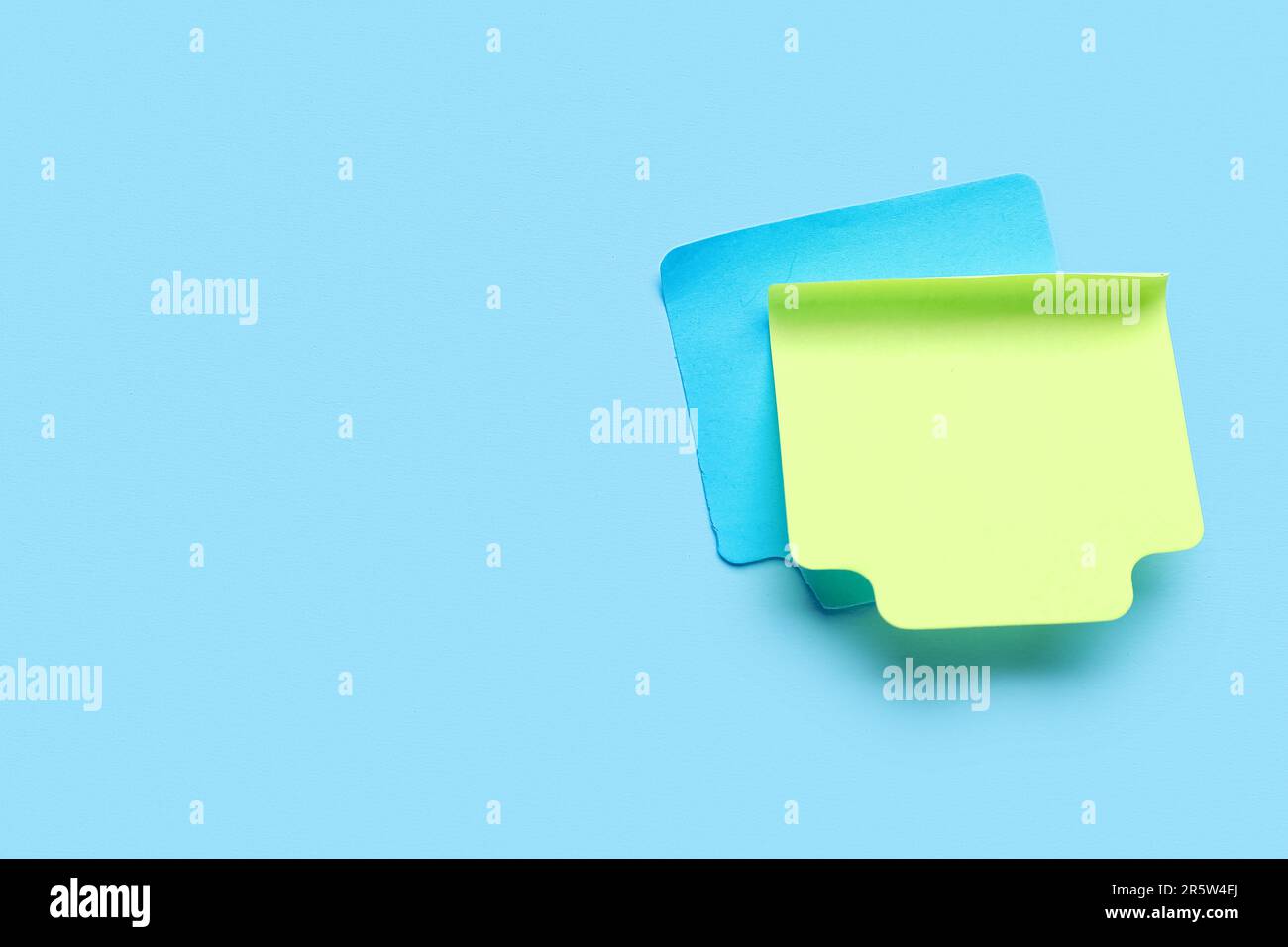 Sticky notes on blue background. Update concept Stock Photo - Alamy