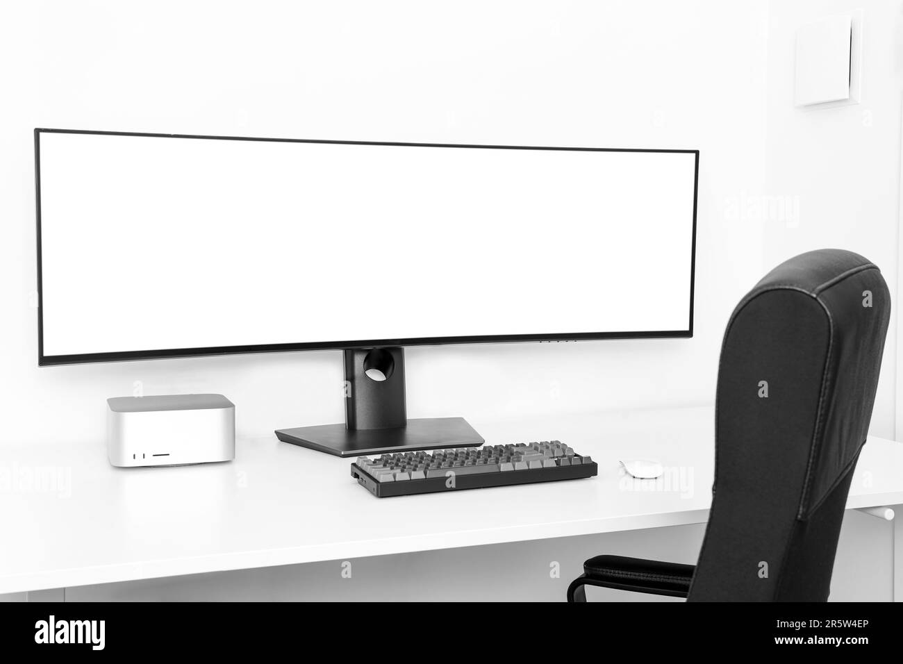 Modern workplace with computer and wi-fi router near light wall Stock ...