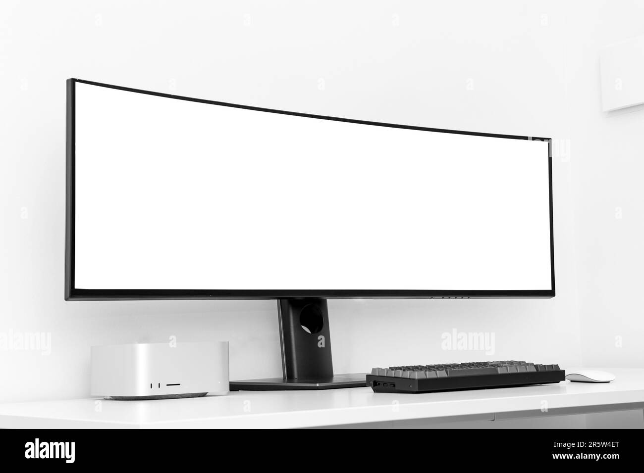 Modern workplace with computer and wi-fi router near light wall Stock ...