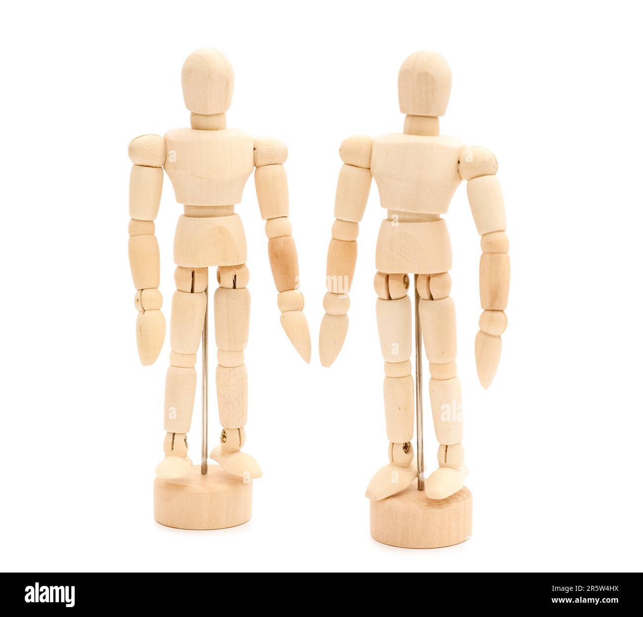 Wooden dummies on white background Stock Photo - Alamy
