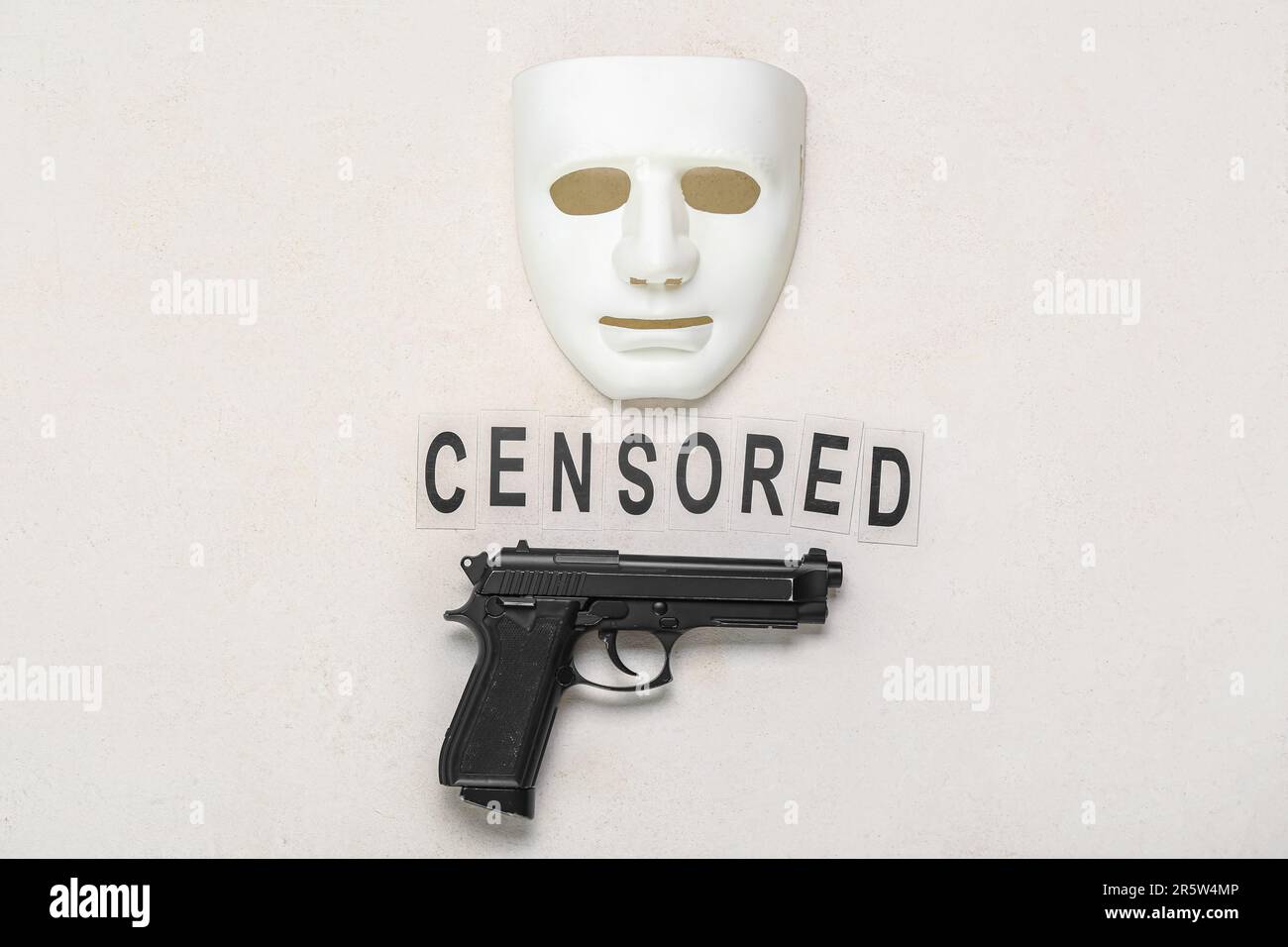 Word CENSORED with gun and mask on white background Stock Photo - Alamy
