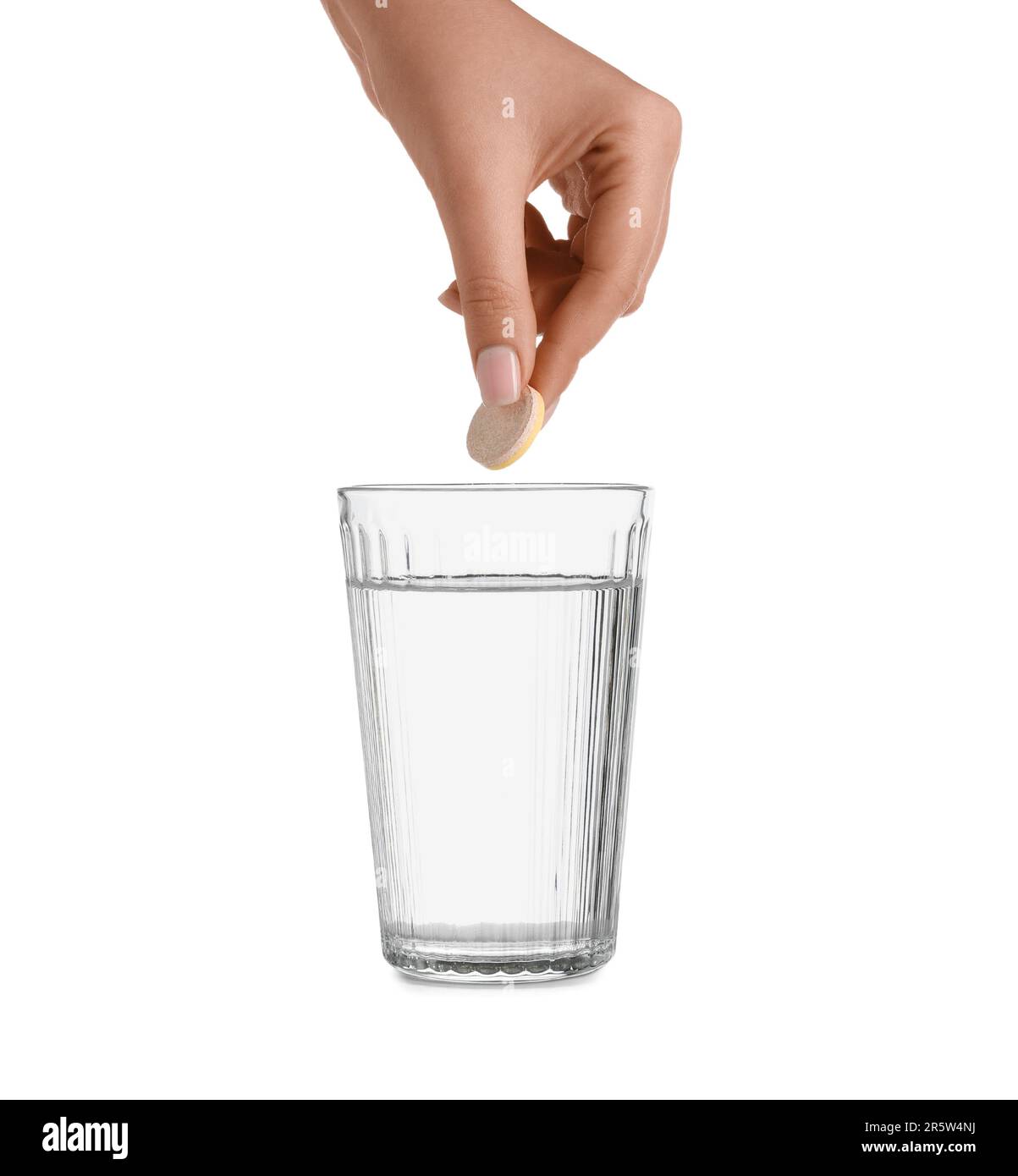 Woman putting soluble tablet into glass of water isolated on white ...