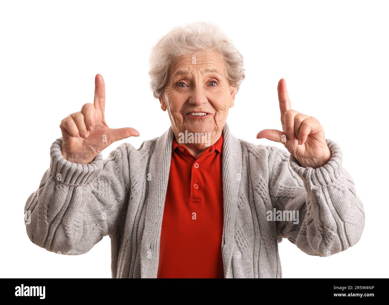 Senior woman showing loser gesture on white background Stock Photo - Alamy
