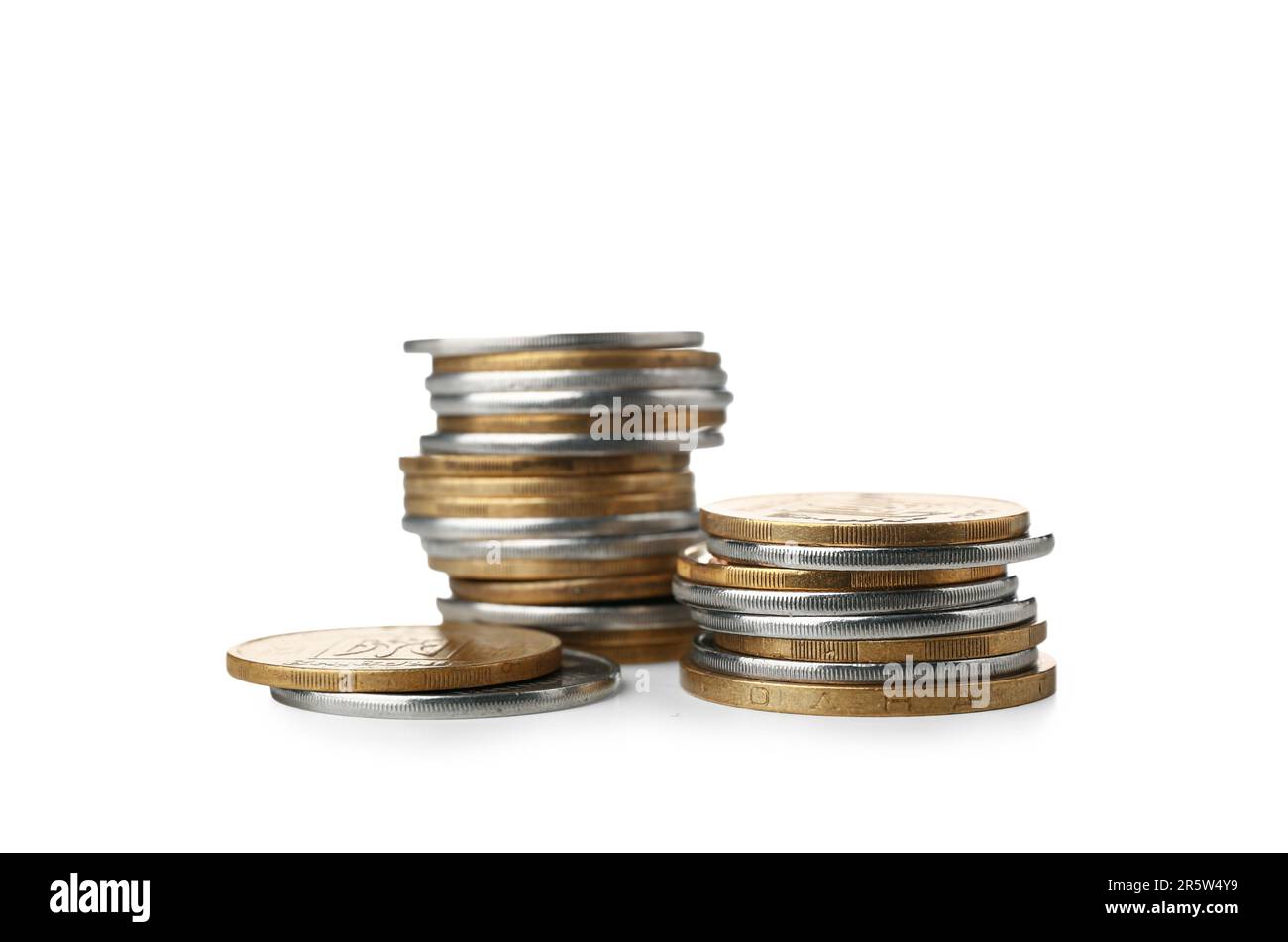 Stacks of coins isolated on white background Stock Photo - Alamy