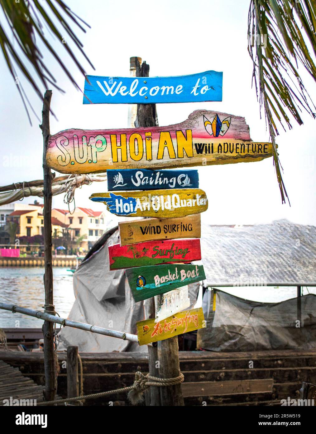 Colourful "Welcome" road sign board near Vietnam Hoi An old town river ...