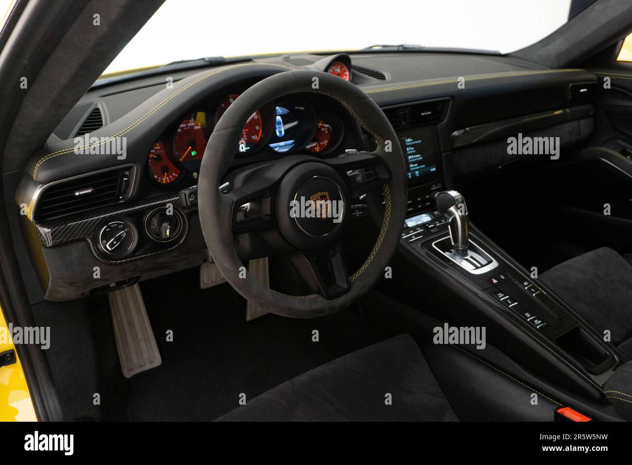 The inside of a luxury sports car, including a stylish dashboard and a ...