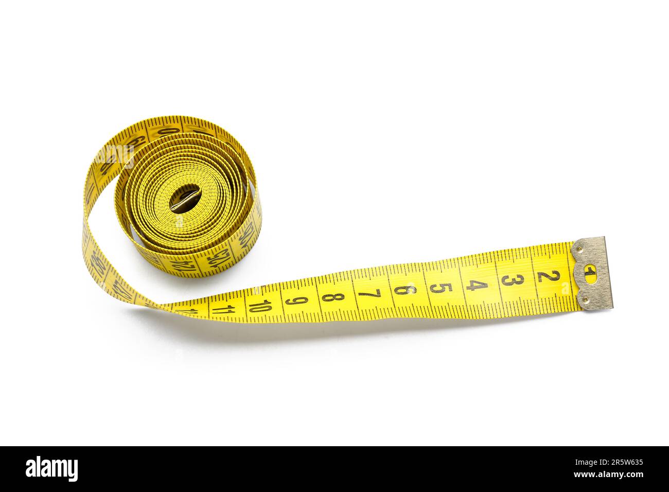 Yellow tape measure on white background Stock Photo - Alamy