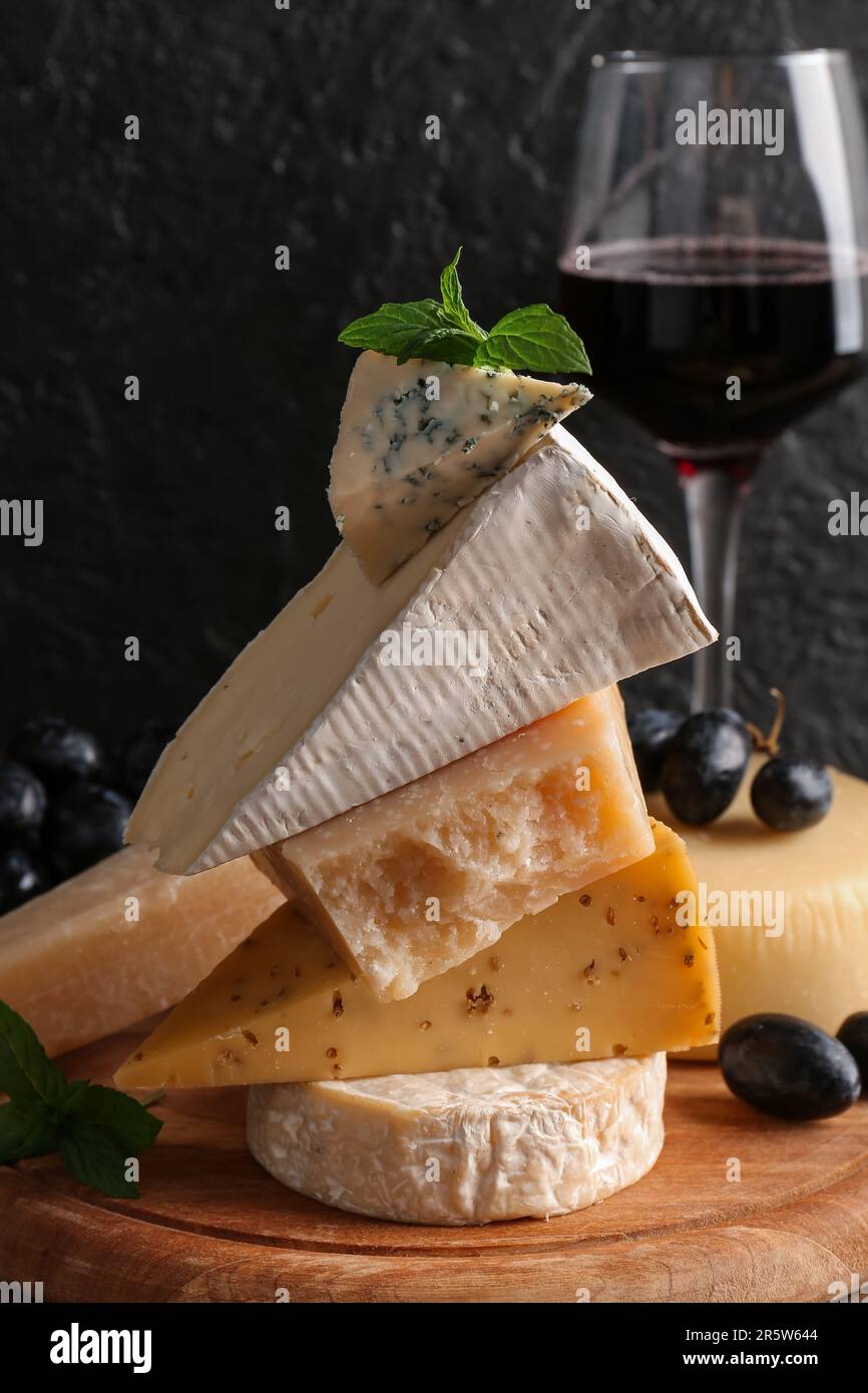 Different types of tasty cheese on table Stock Photo - Alamy