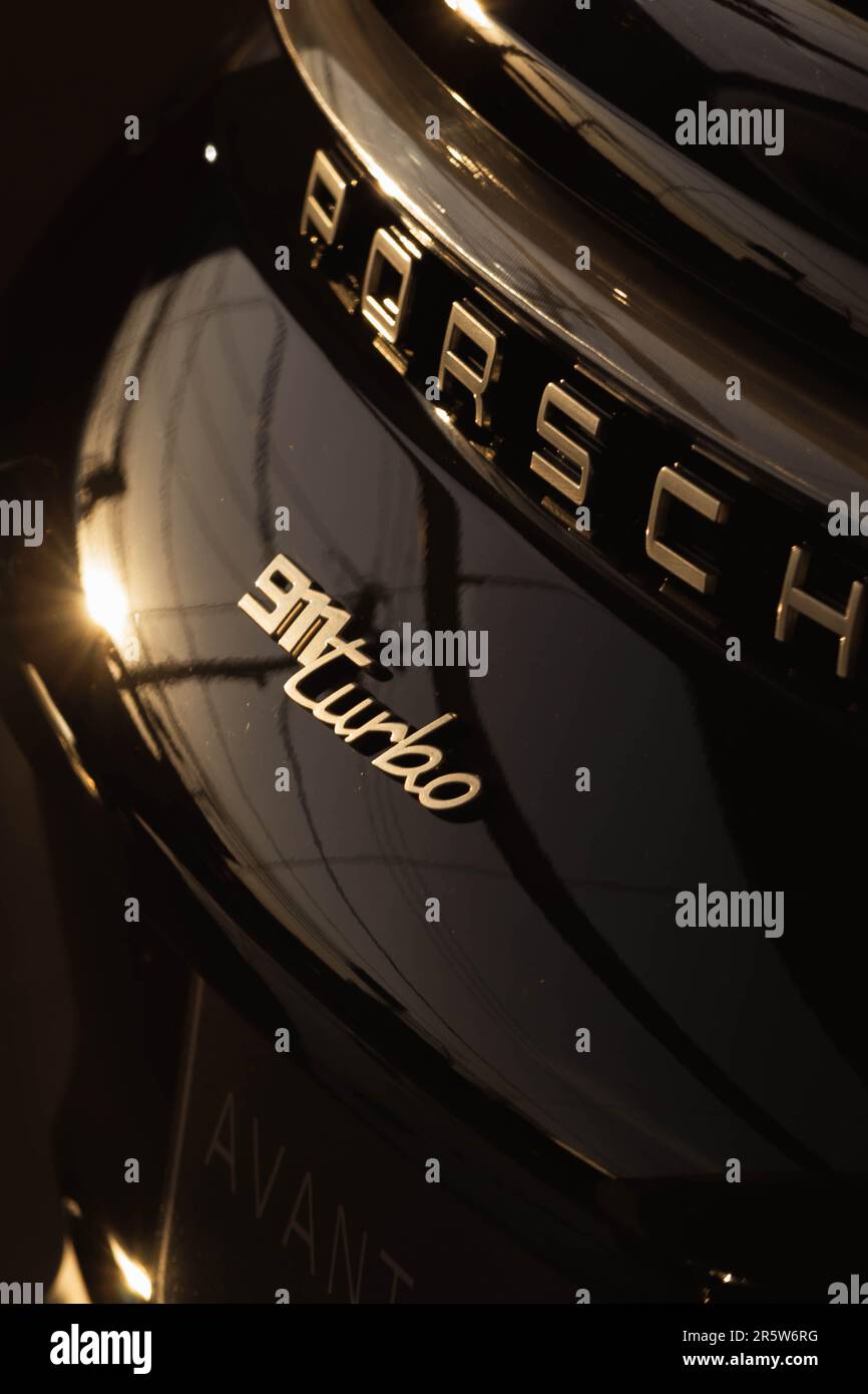 Photograph of a Porsche car logo with a silver and black finish in ...