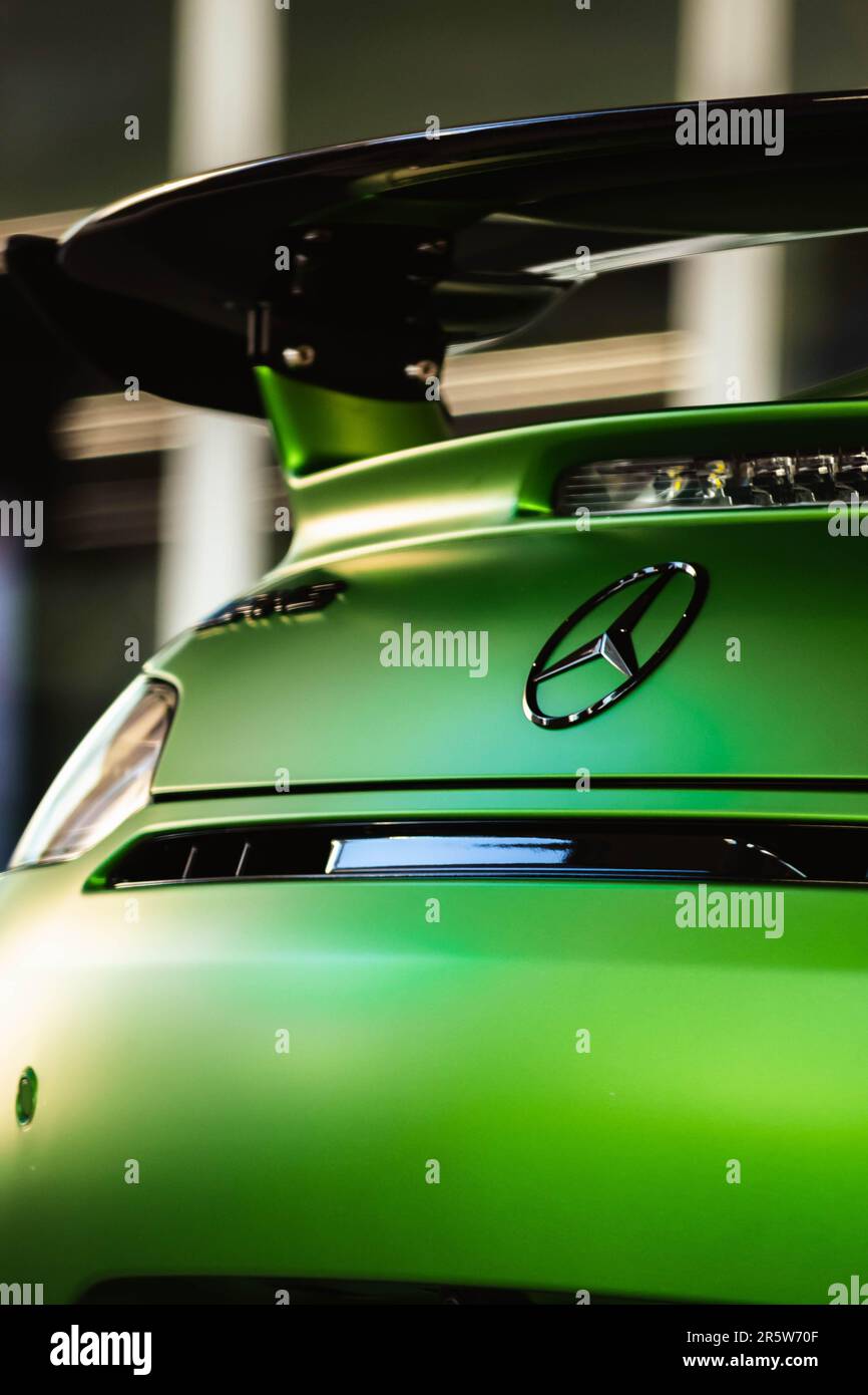 A green Mercedes-Benz SLC Convertible parked in front of a pristine ...