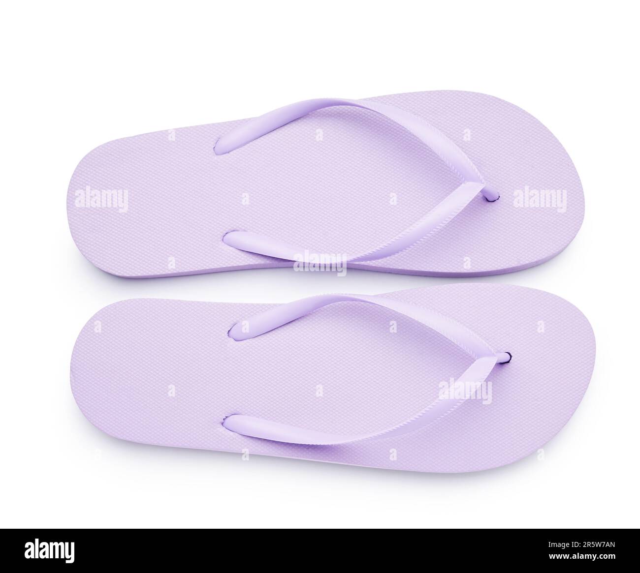 Pair of stylish lilac flip-flops on white background Stock Photo - Alamy