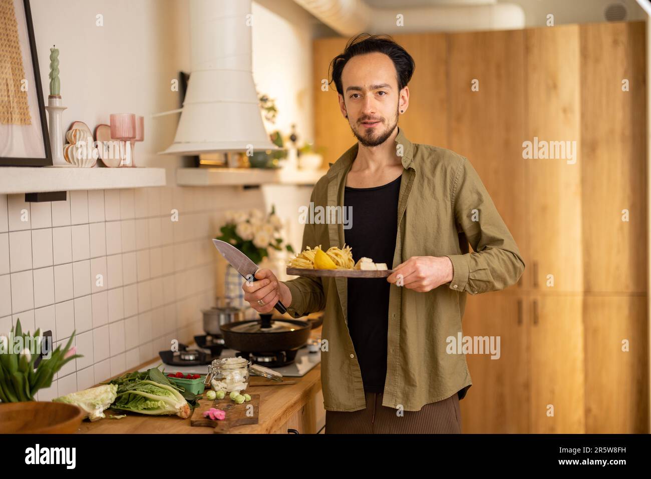 Man cooking italian pasta at home Stock Photo - Alamy