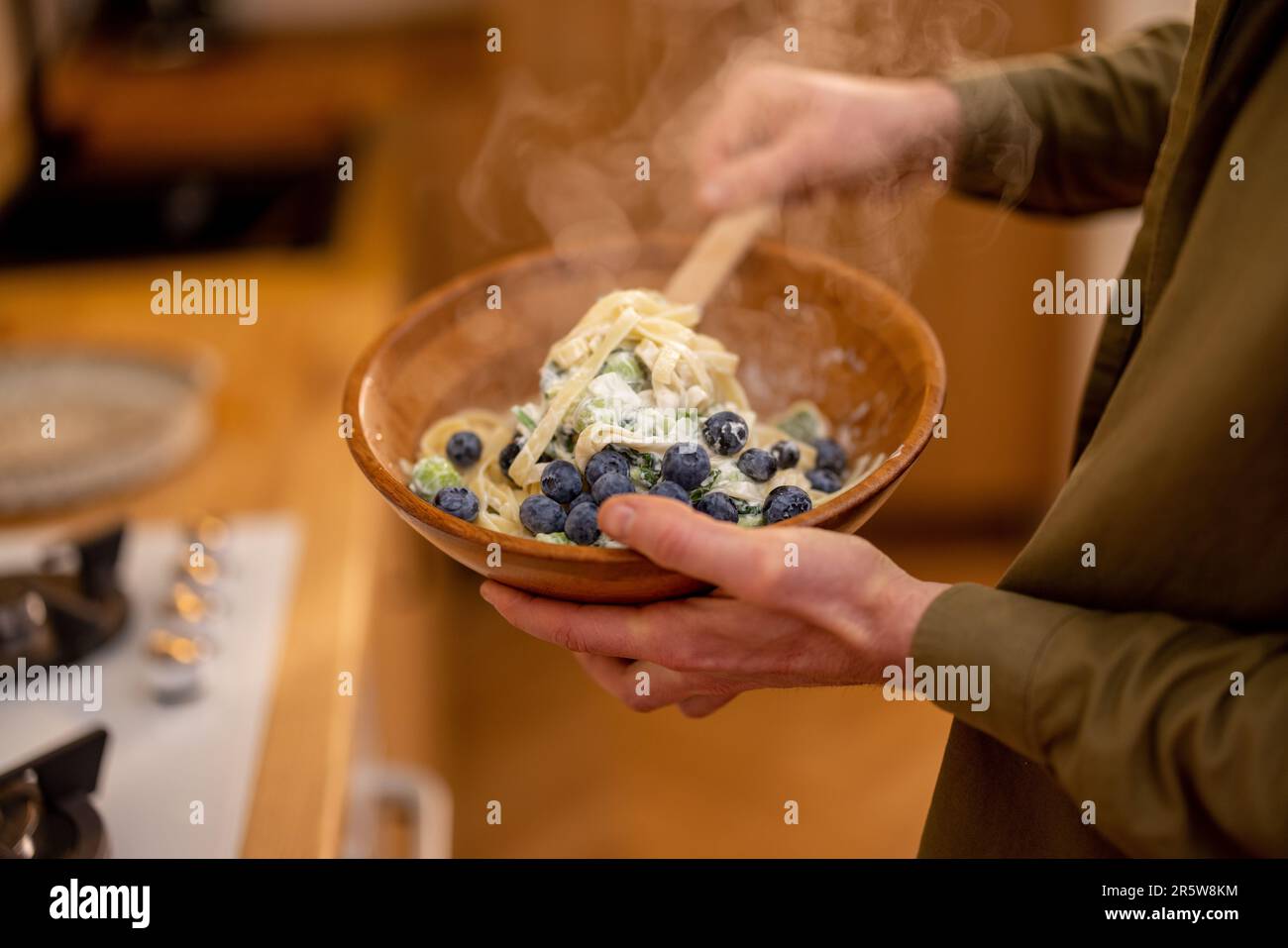 Mixing pasta tasty pasta Stock Photo - Alamy