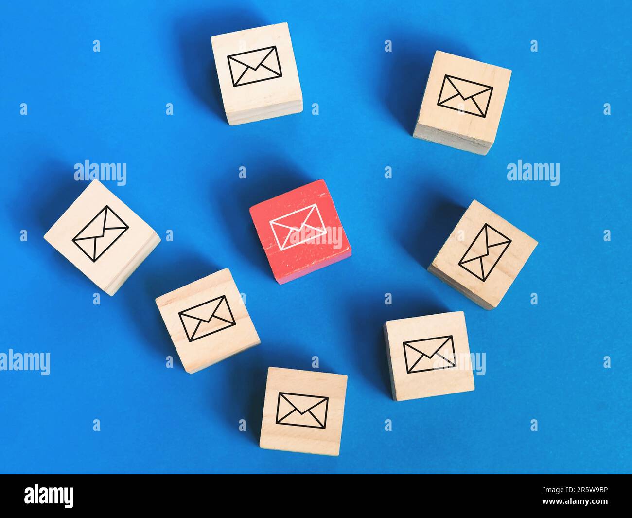 A set of wooden blocks with envelope signs. New email notification and ...