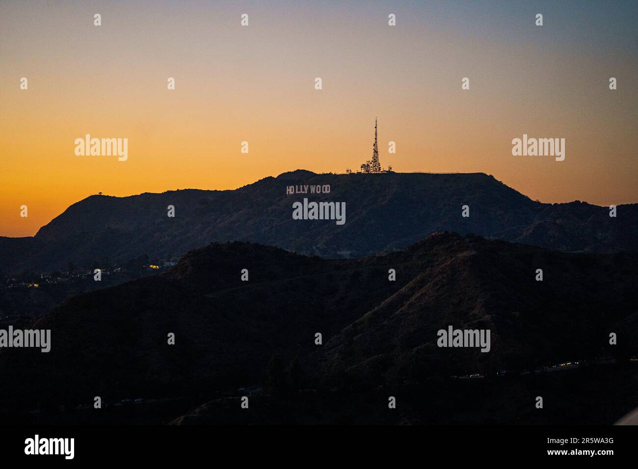 An iconic view of the Hollywood Sign illuminated by the setting sun ...