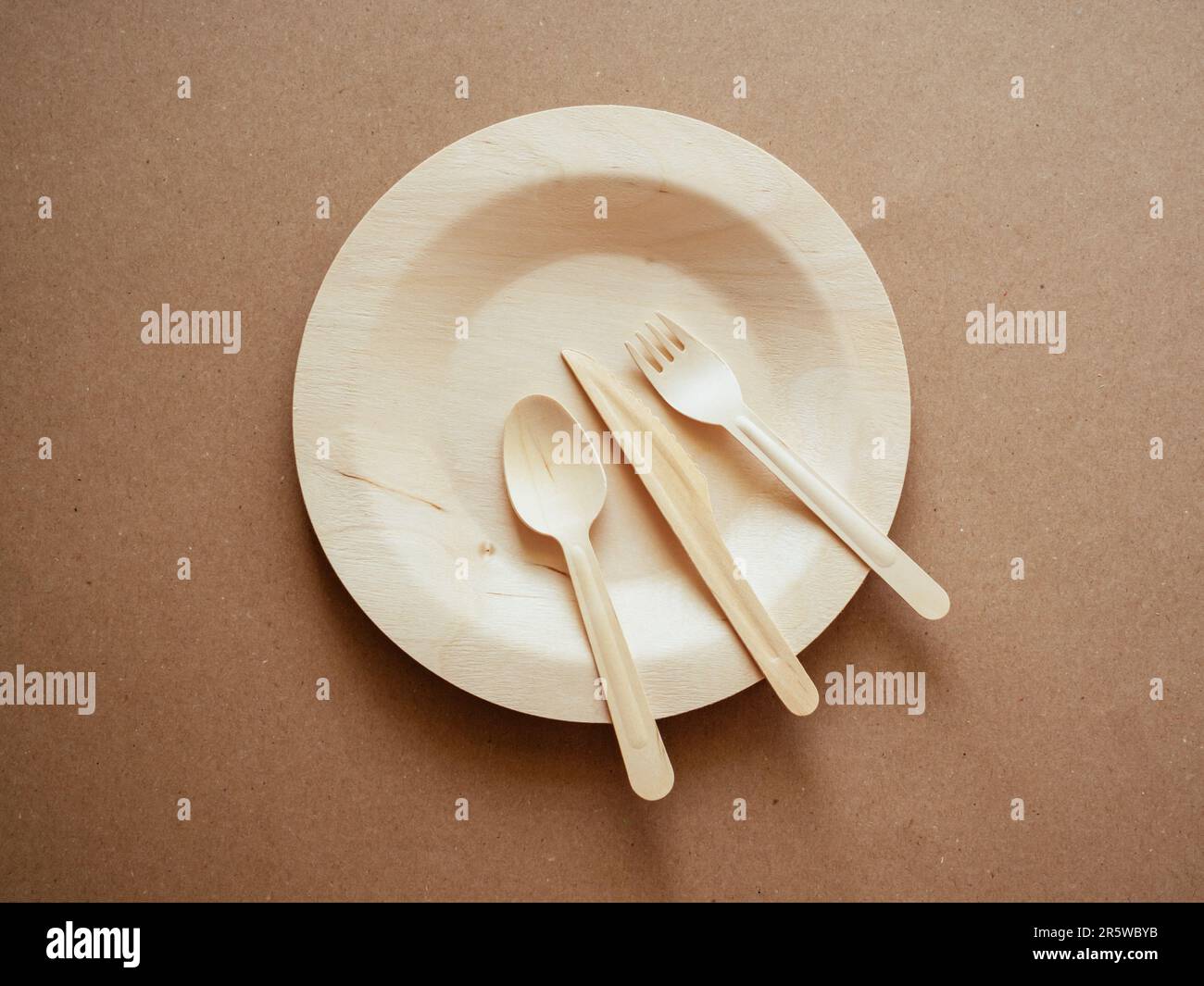 Top view of wooden, biodegradable, eco friendly tableware set on the ...