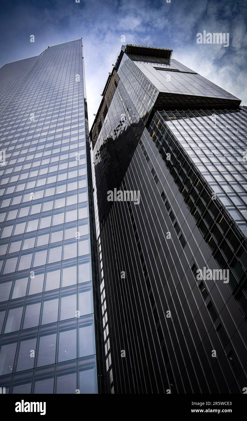 An aerial view of a bustling cityscape, with tall buildings lined up in ...