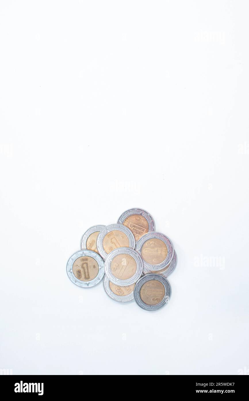 A stack of Mexican one peso coins on a white background Stock Photo - Alamy