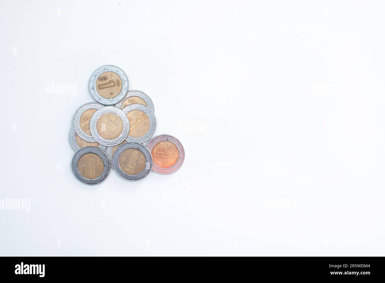 A stack of Mexican one peso coins on a white background Stock Photo - Alamy