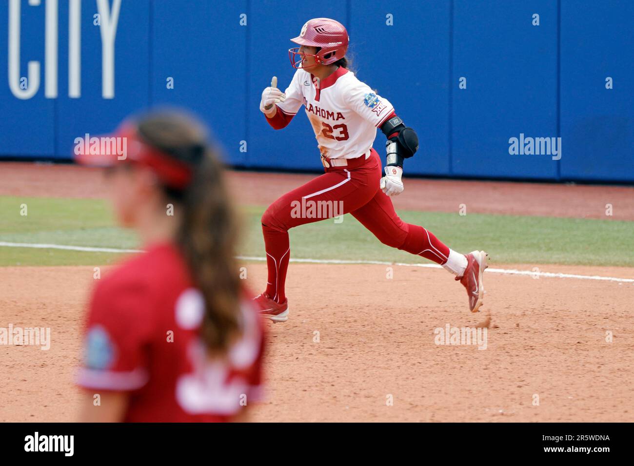 Oklahoma's Tiare Jennings (23) runs to second base after hitting a two ...