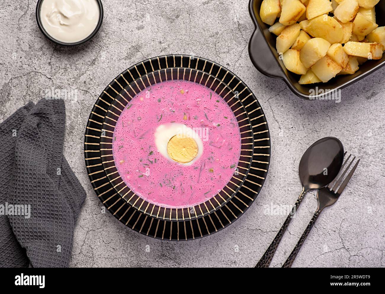 Food photography of cold beetroot soup, borscht, dill, boiled egg ...