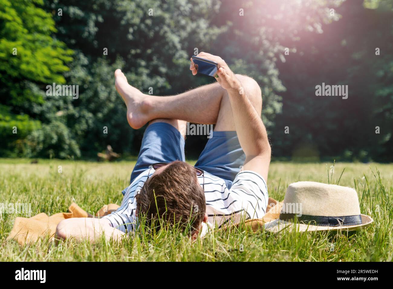 Back view man phone green hi-res stock photography and images - Alamy