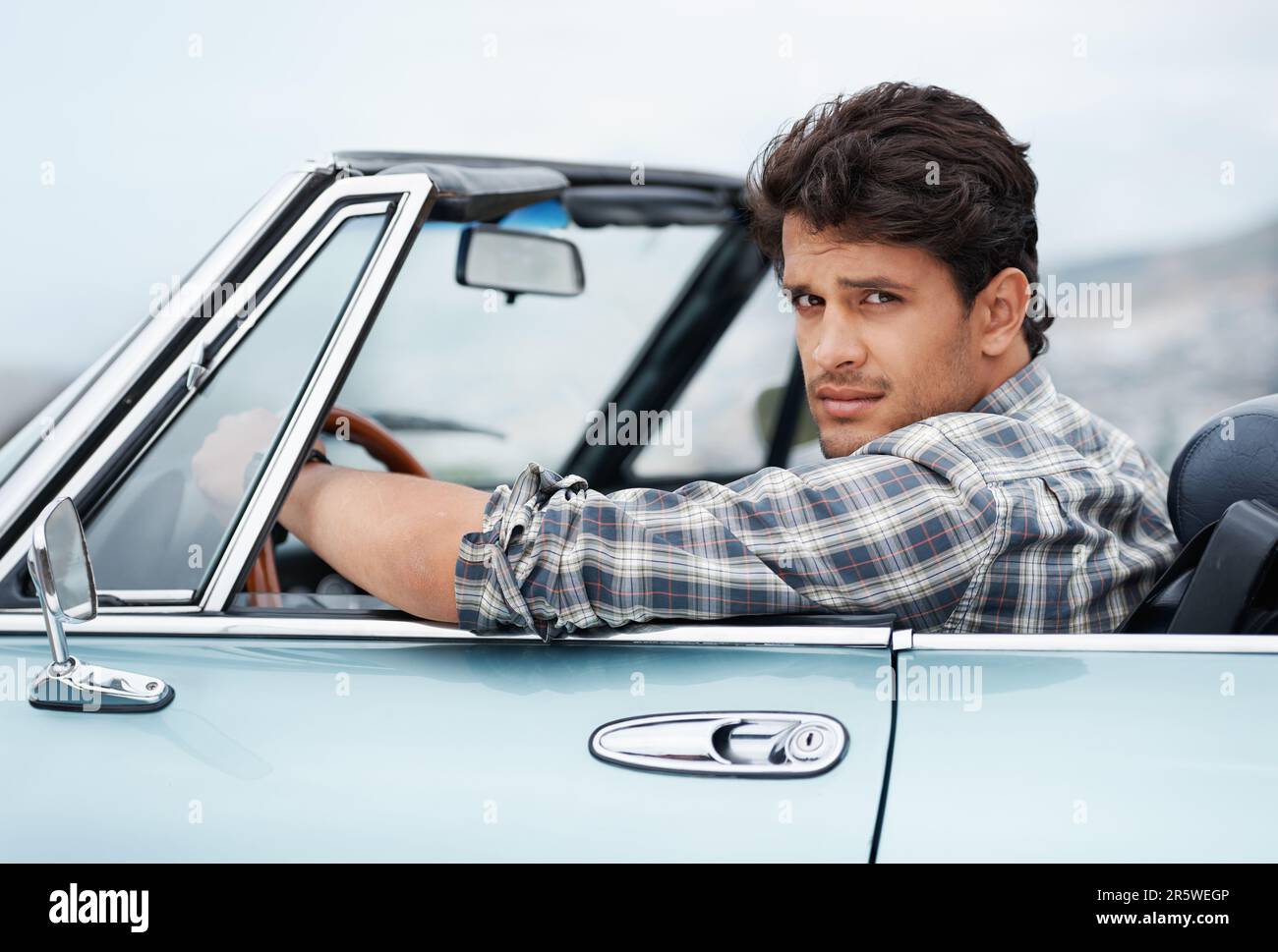 Giving you a second glance...Handsome young guy sitting in his ...