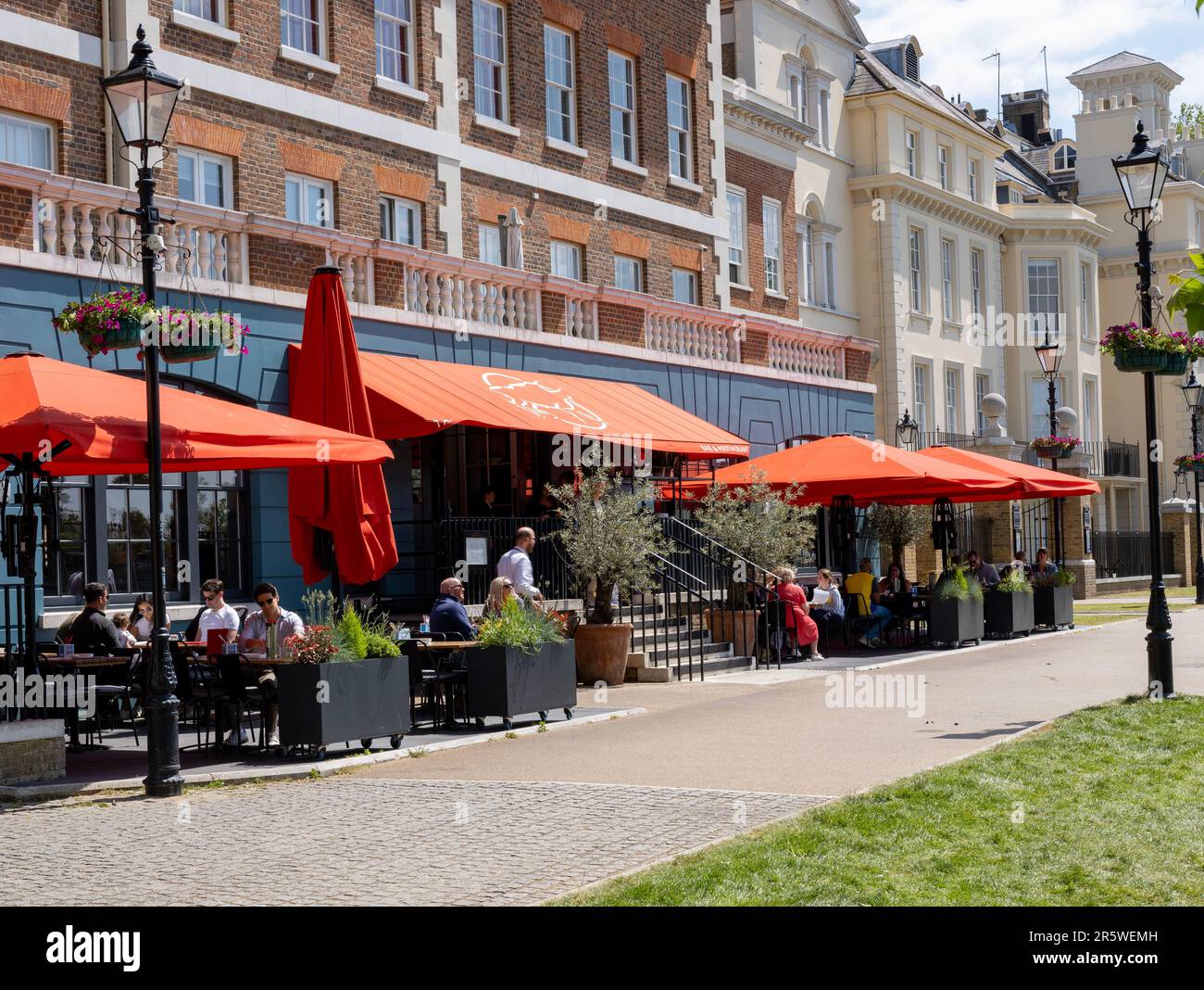 Richmond, Surrey, UK; a riverside walk with outdoor tables for a ...