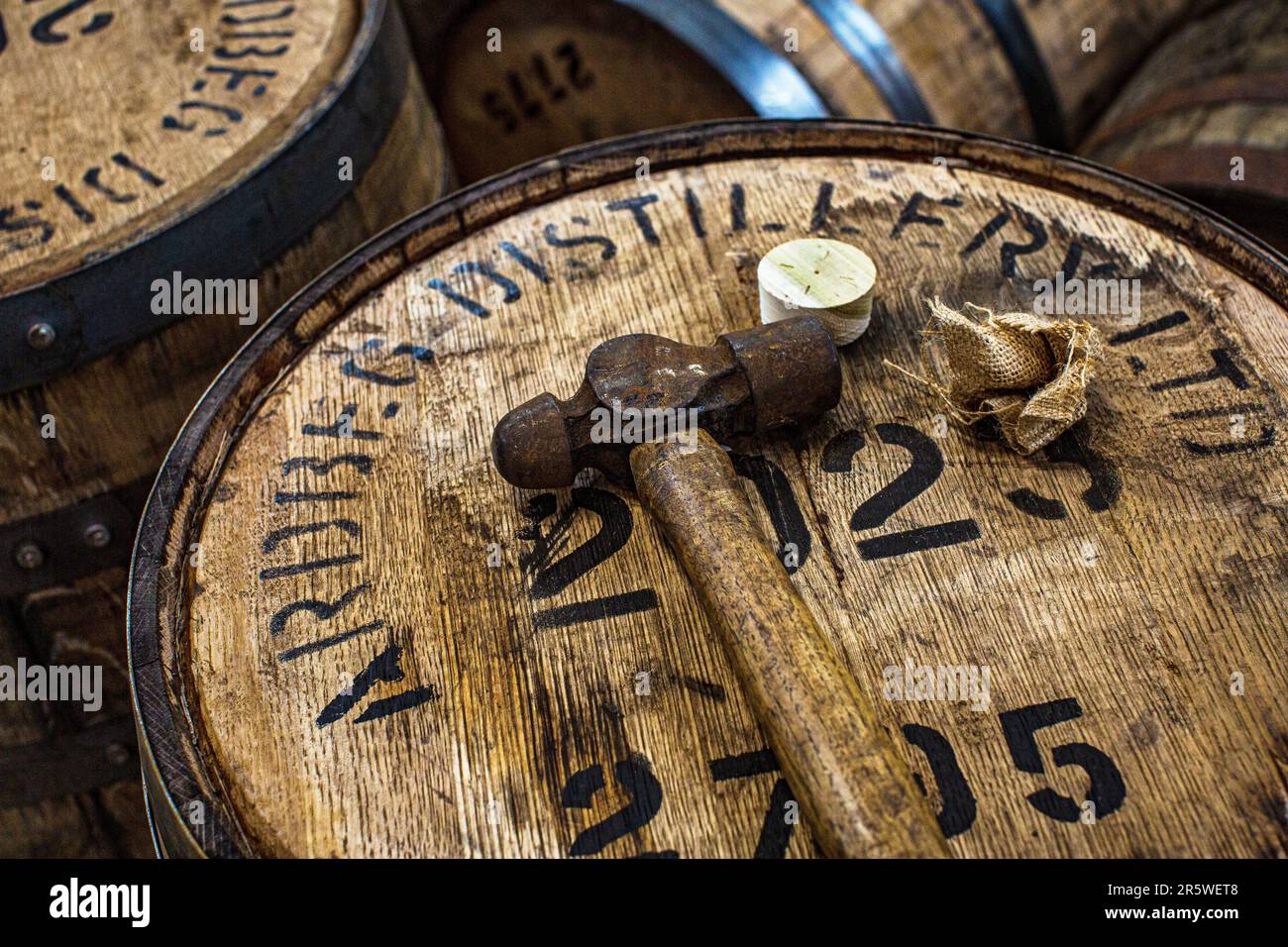 Hammer with whiskey barrel bung at Ardbeg Distillery, Isle of Islay ...