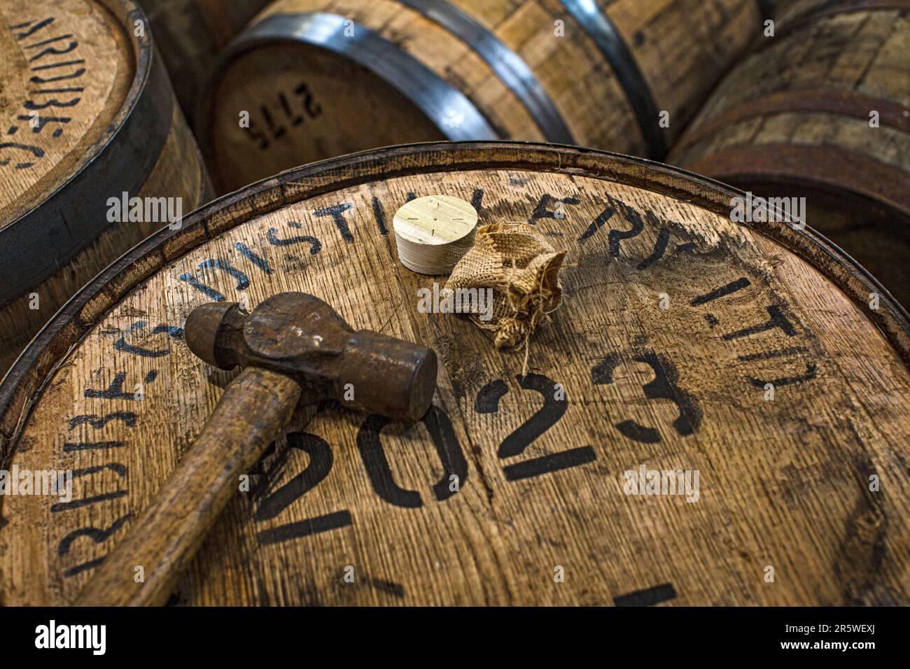 Hammer with whiskey barrel bung at Ardbeg Distillery, Isle of Islay ...
