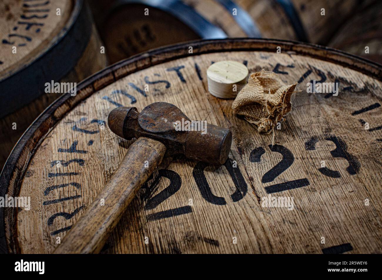 Hammer with whiskey barrel bung at Ardbeg Distillery, Isle of Islay ...
