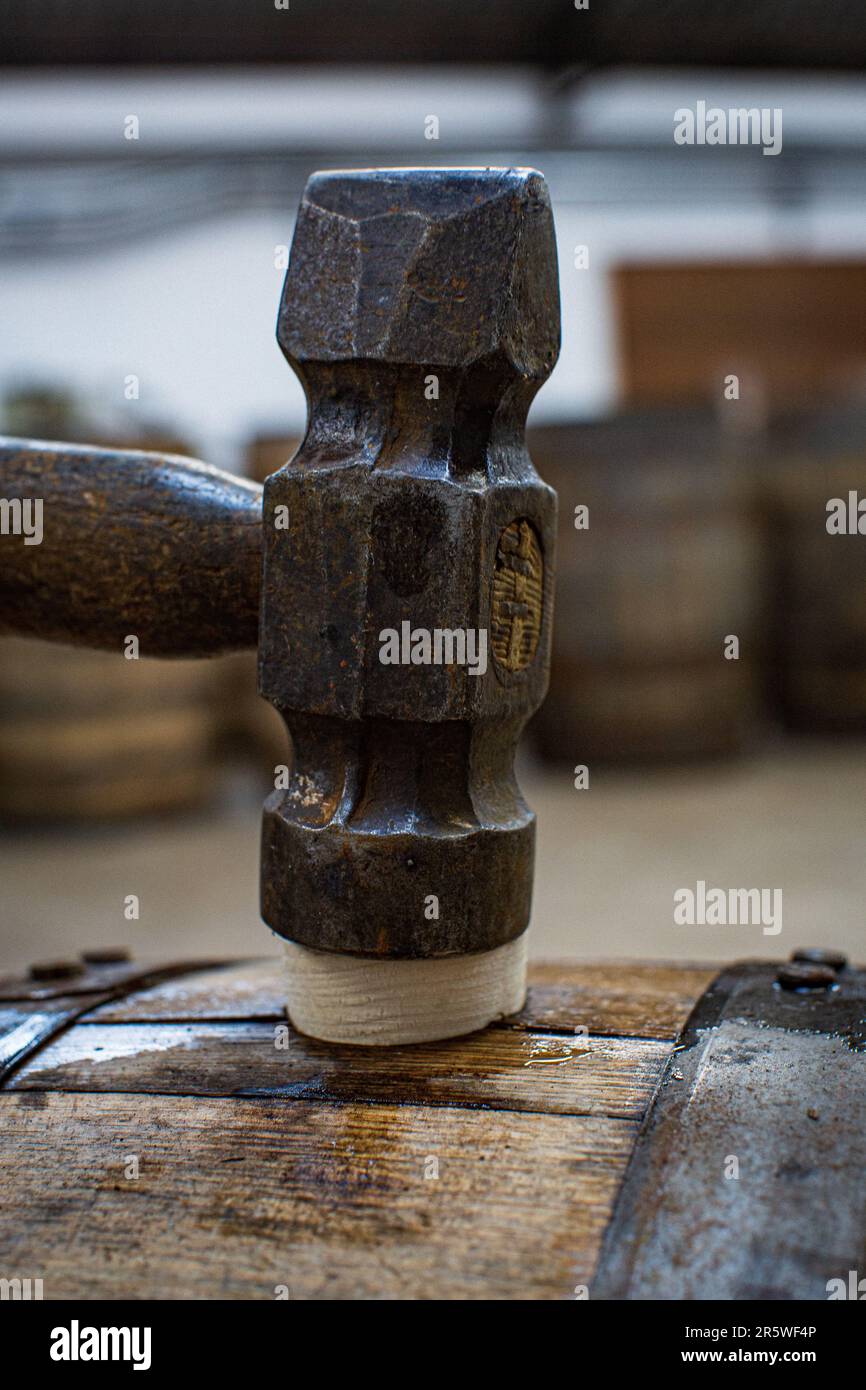 Hammer with whiskey barrel bung at Ardbeg Distillery, Isle of Islay ...