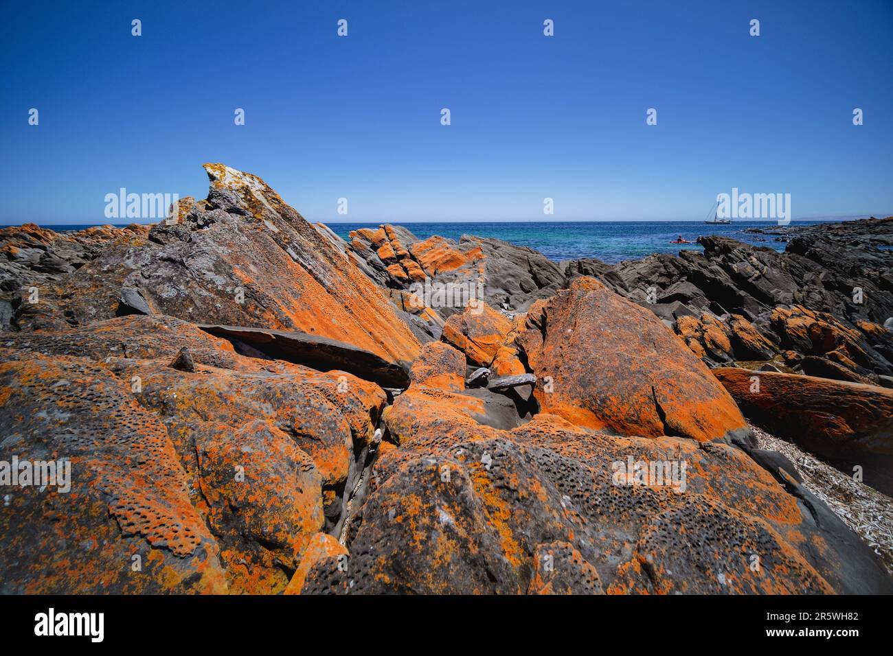 A large rock formation on a rocky coastline in Kangaroo island against ...