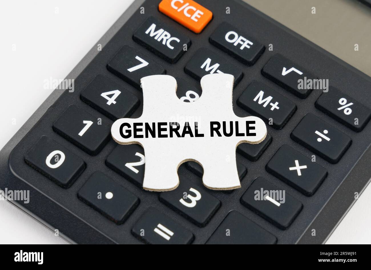 Business concept. On the calculator is a puzzle with the inscription ...