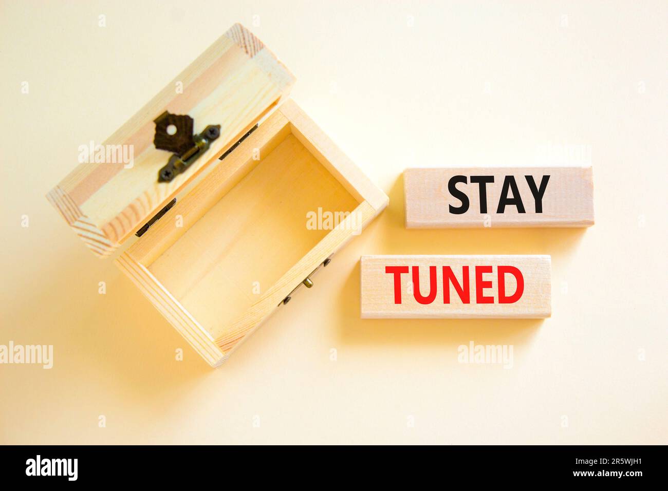 Stay tuned symbol. Concept words Stay tuned on wooden blocks on a ...