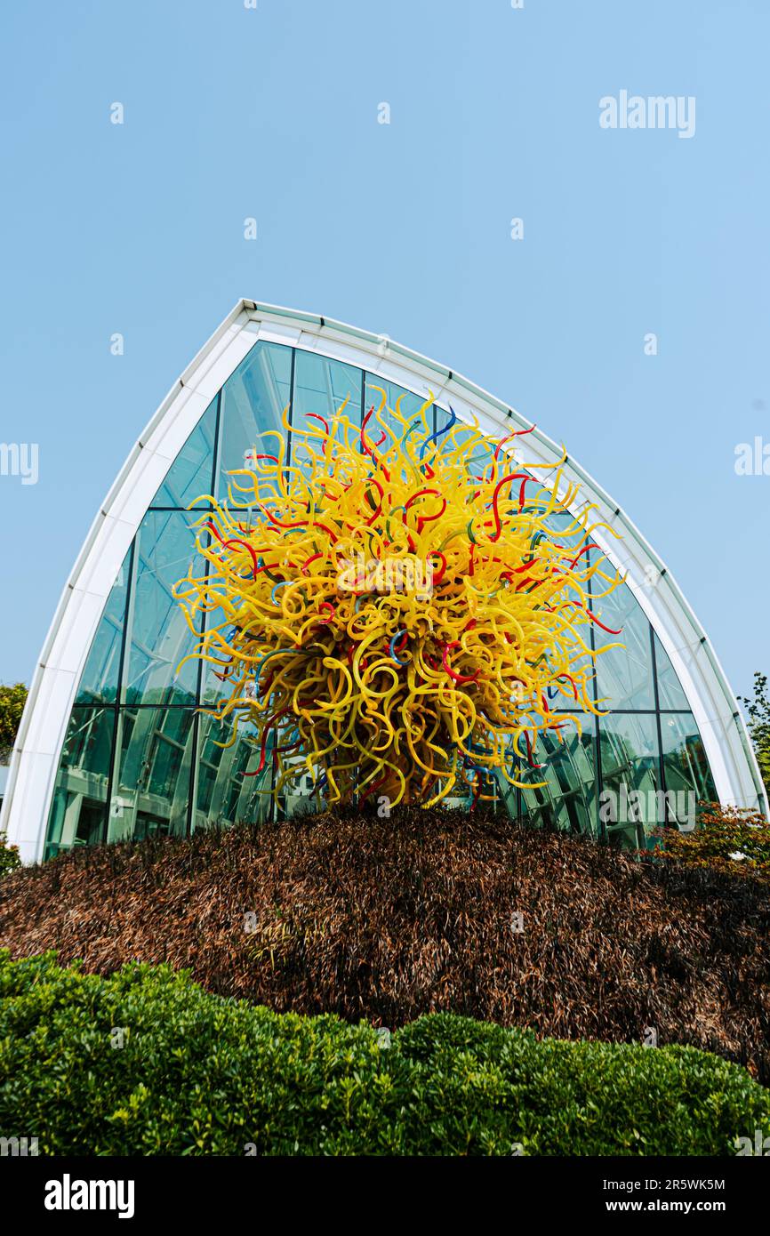 Bright sunshine radiates through the glass windows of a modern ...