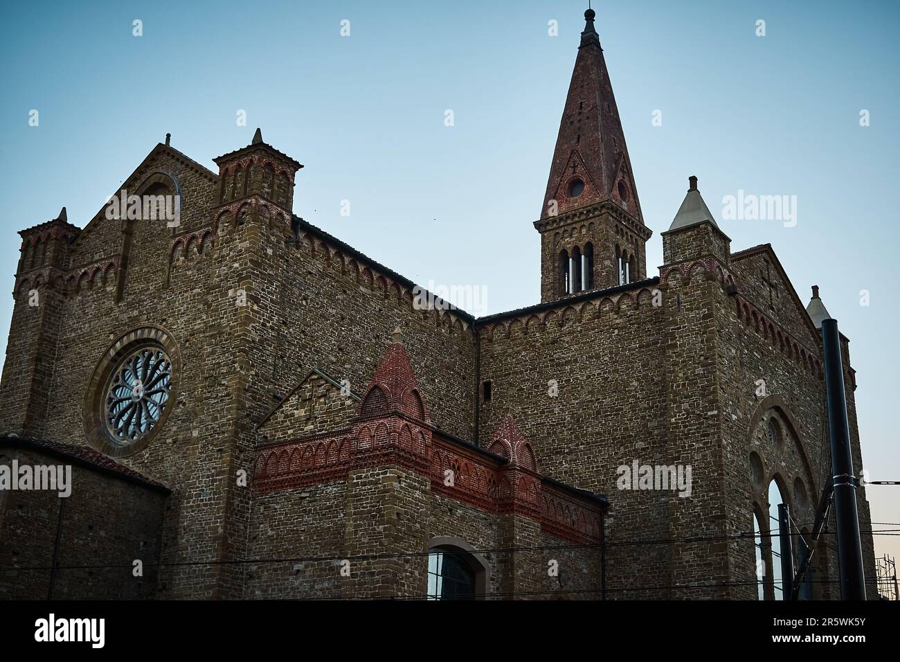Aerial view of an ornate church steeple atop a traditional religious ...