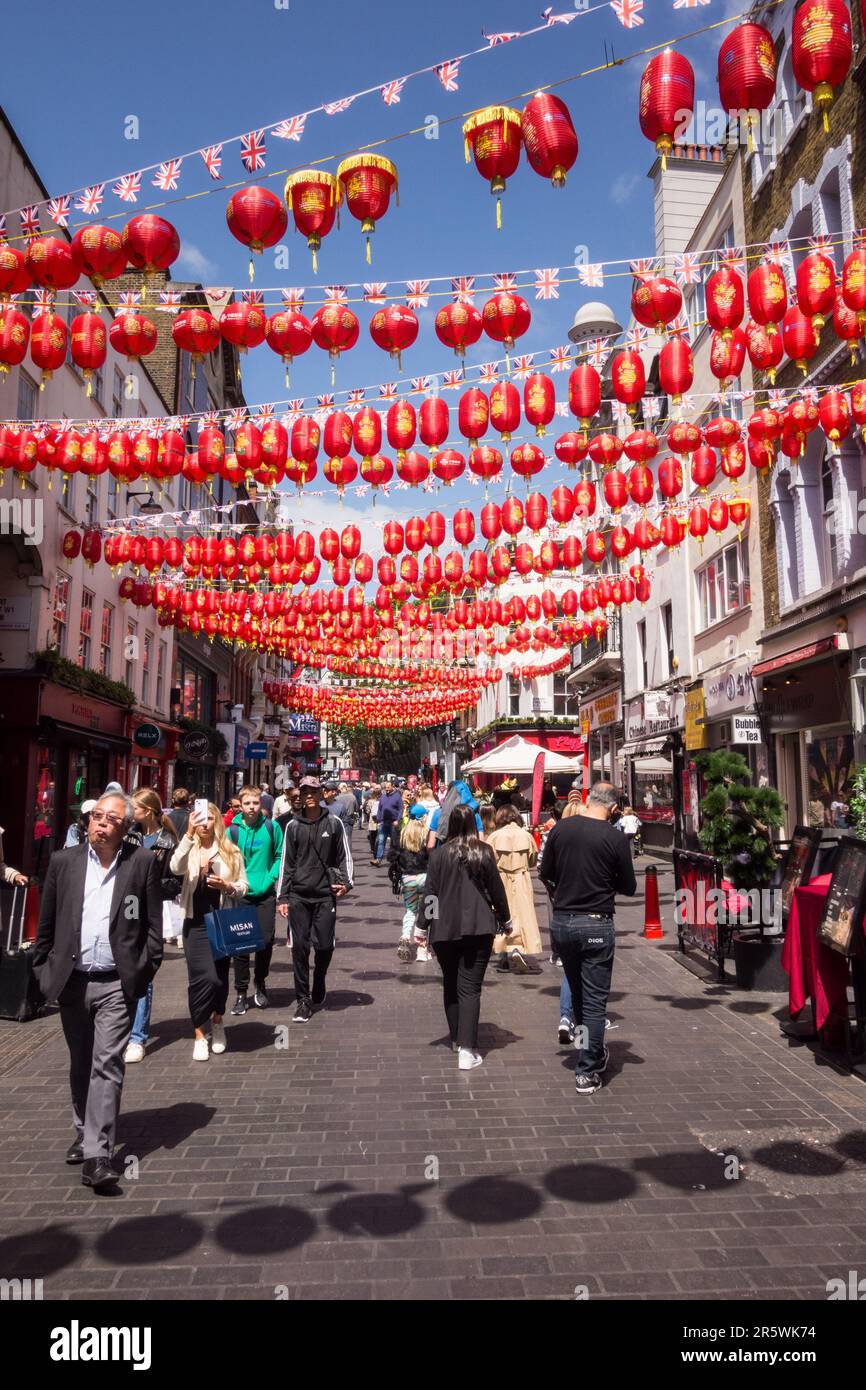 People, tourists and red paper lanterns on Macclesfield Street in ...