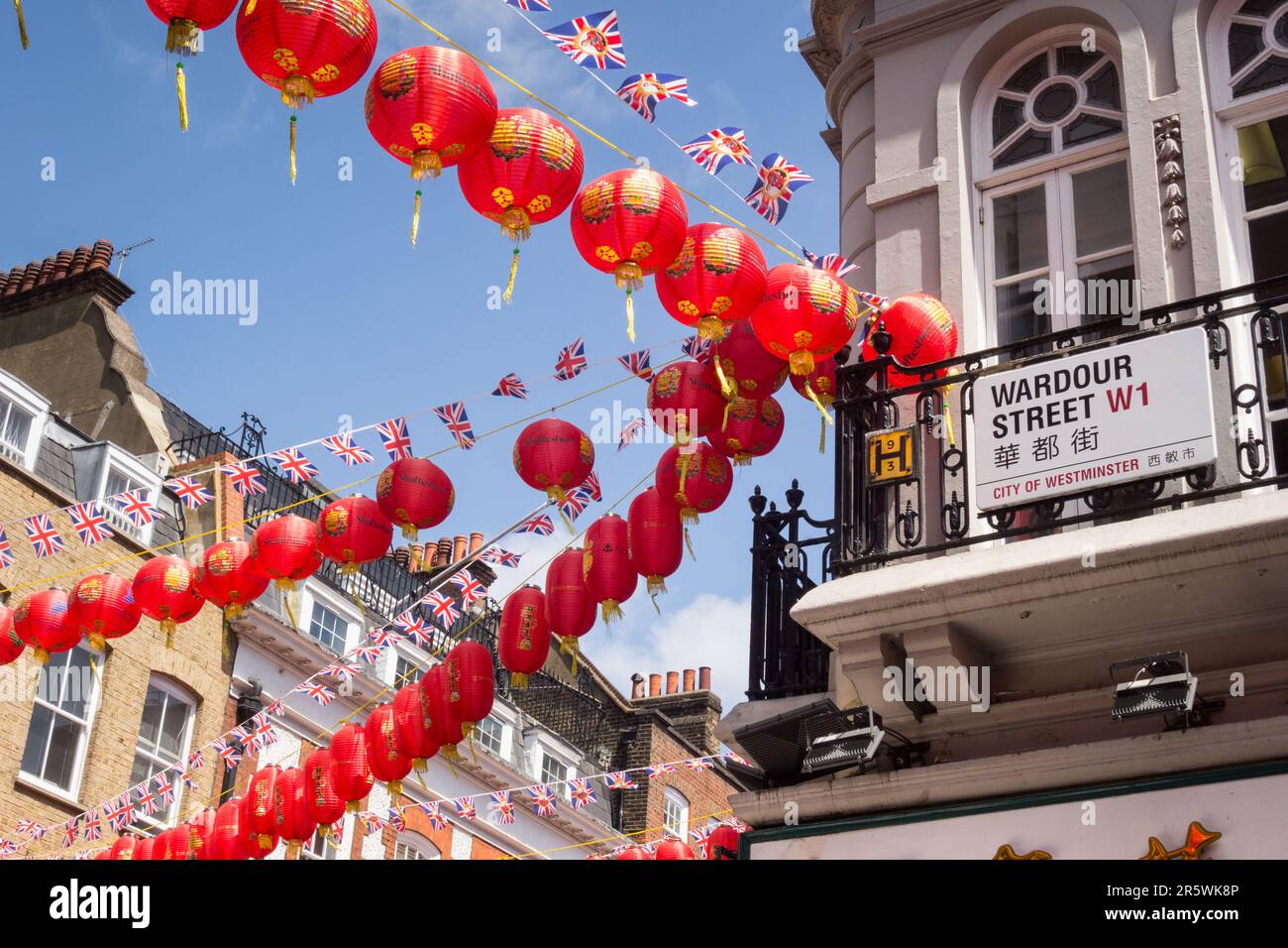Closeup of street sign and red paper lanterns on Wardour Street in Chinatown, Soho, central ...