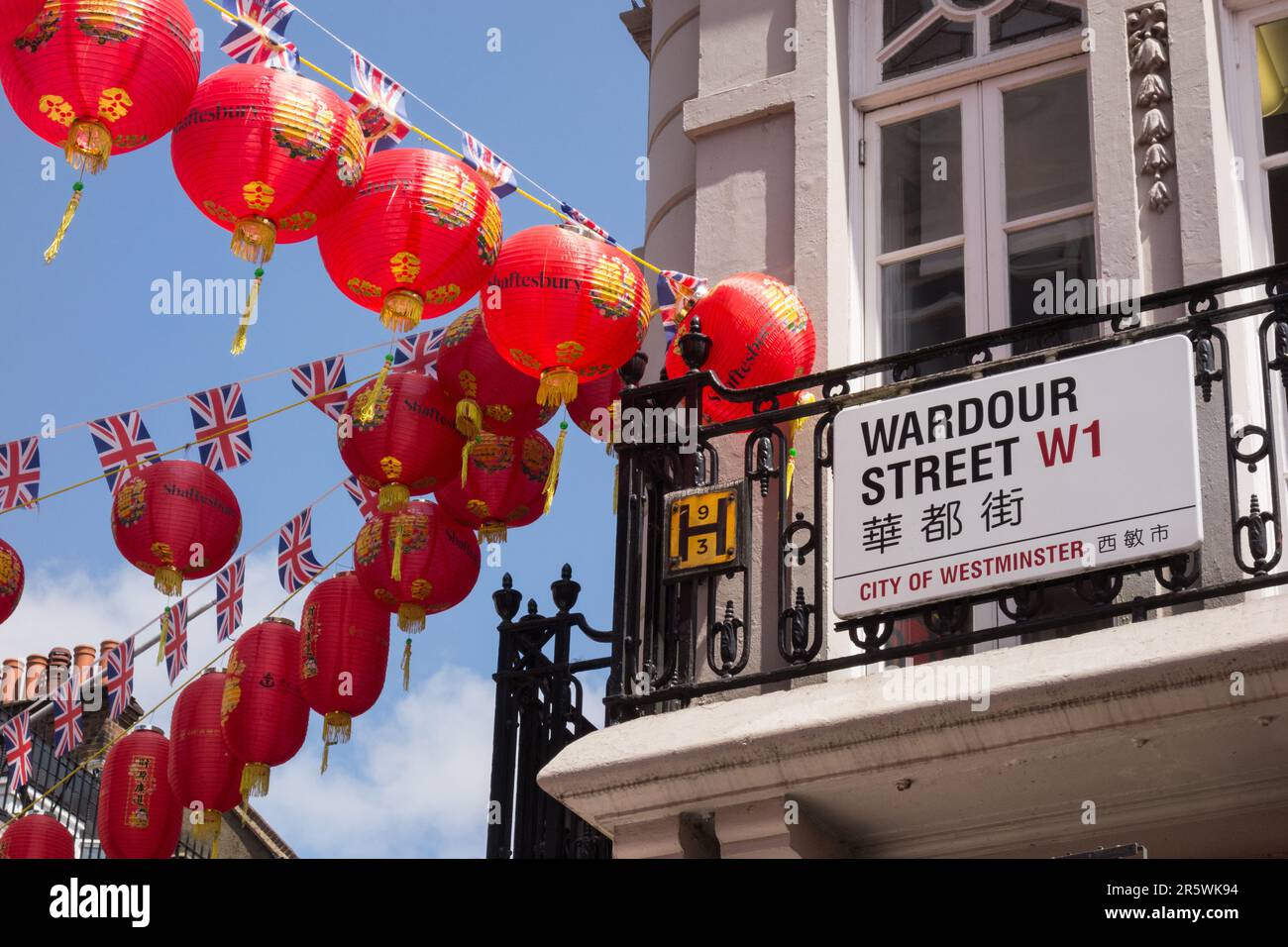 Closeup of street sign and red paper lanterns on Wardour Street in Chinatown, Soho, central ...