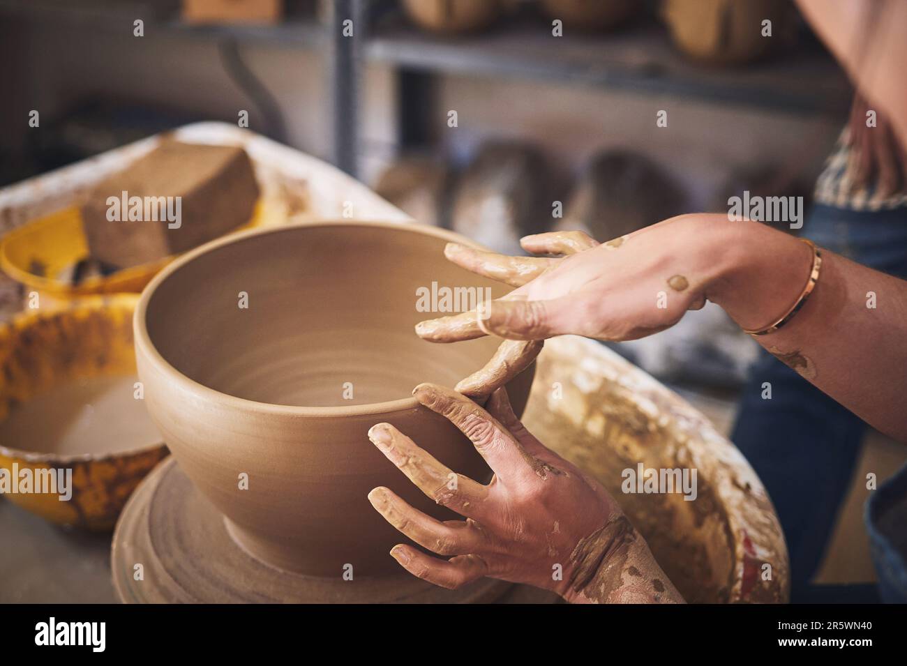 The incredible world of clay. an unrecognisable woman working with clay ...