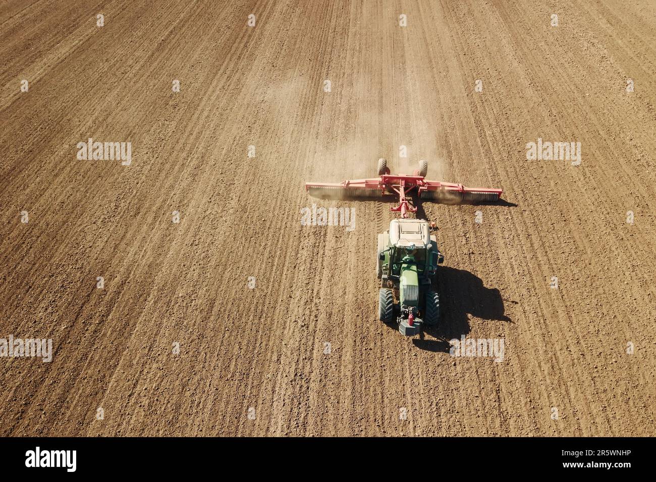 Aerial view Tractor preparing field, Agriculture tractor landscape ...