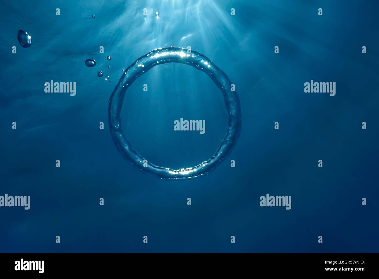 Underwater Bubble Ring Ascends towards the Sun Stock Photo - Alamy