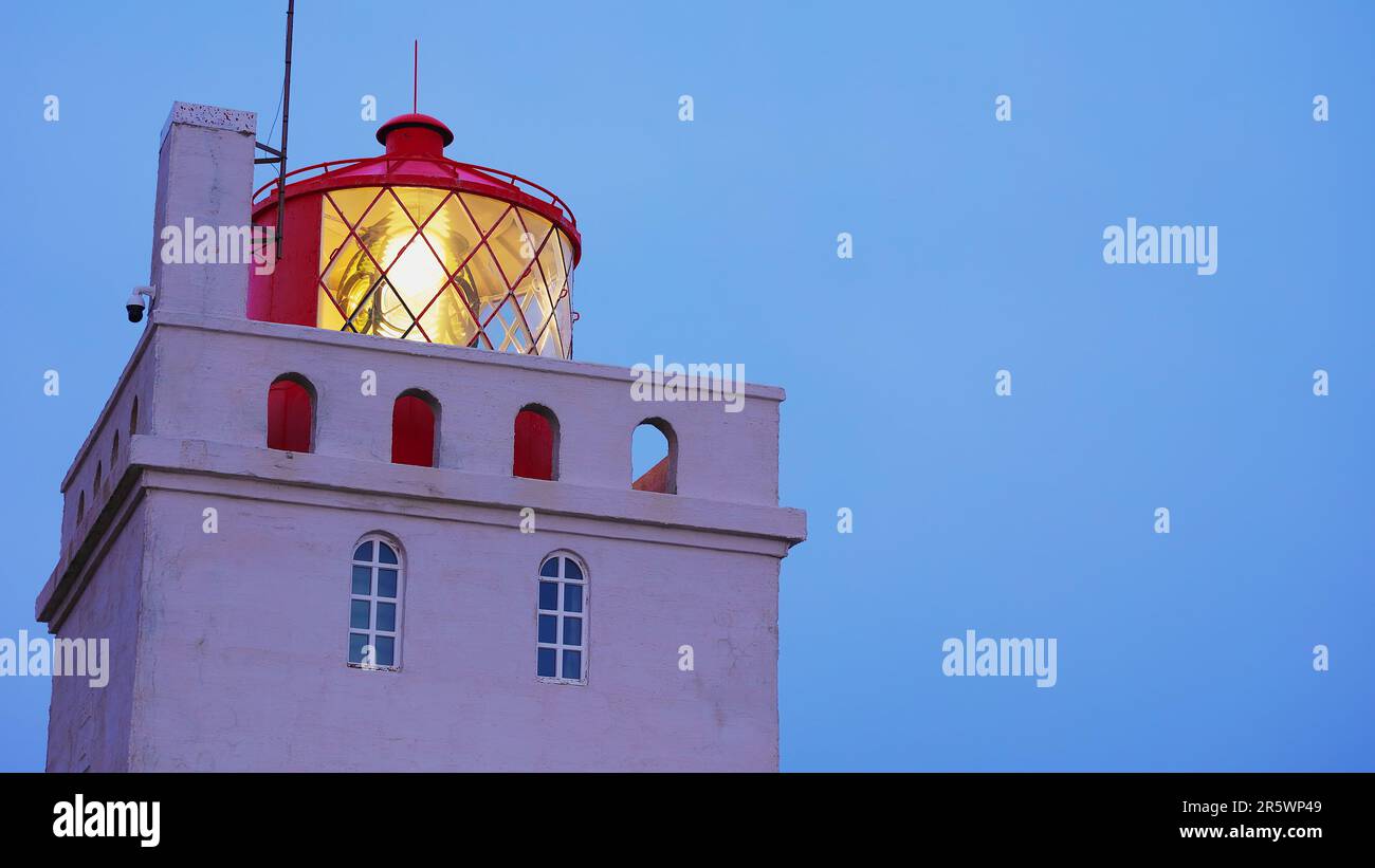 Dyrholaey lighthouse tower on shore, majestic building beacon of light ...