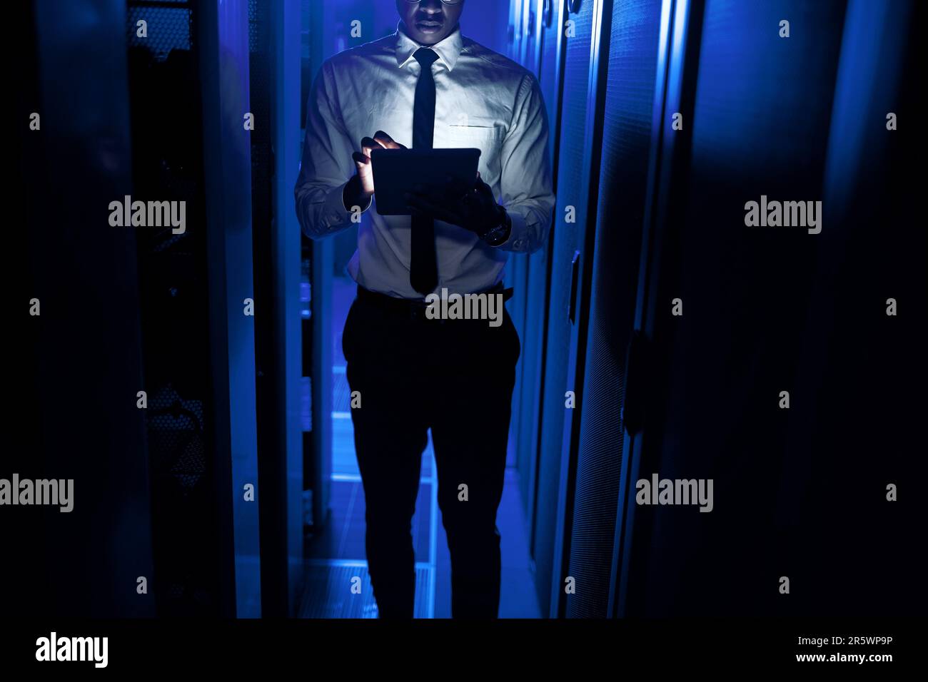 Performing a few administrative duties while monitoring data. Closeup ...