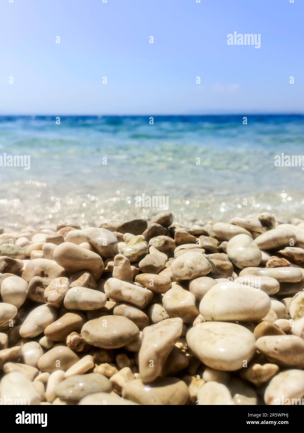 Pebbles Beach Blue Sky, Blue Ocean, Summer Background Stock Photo - Alamy