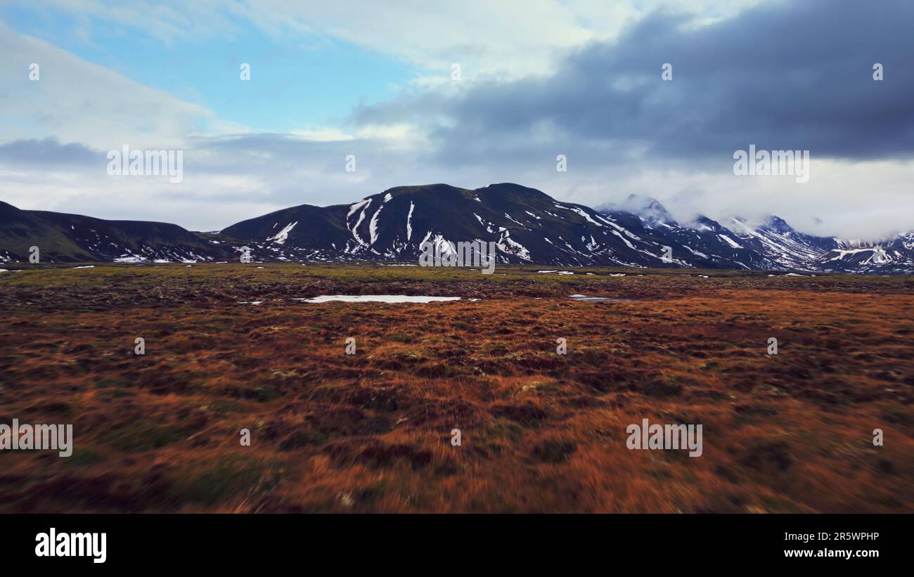 Drone shot of majestic snowy mountains in iclandic landscape with ...
