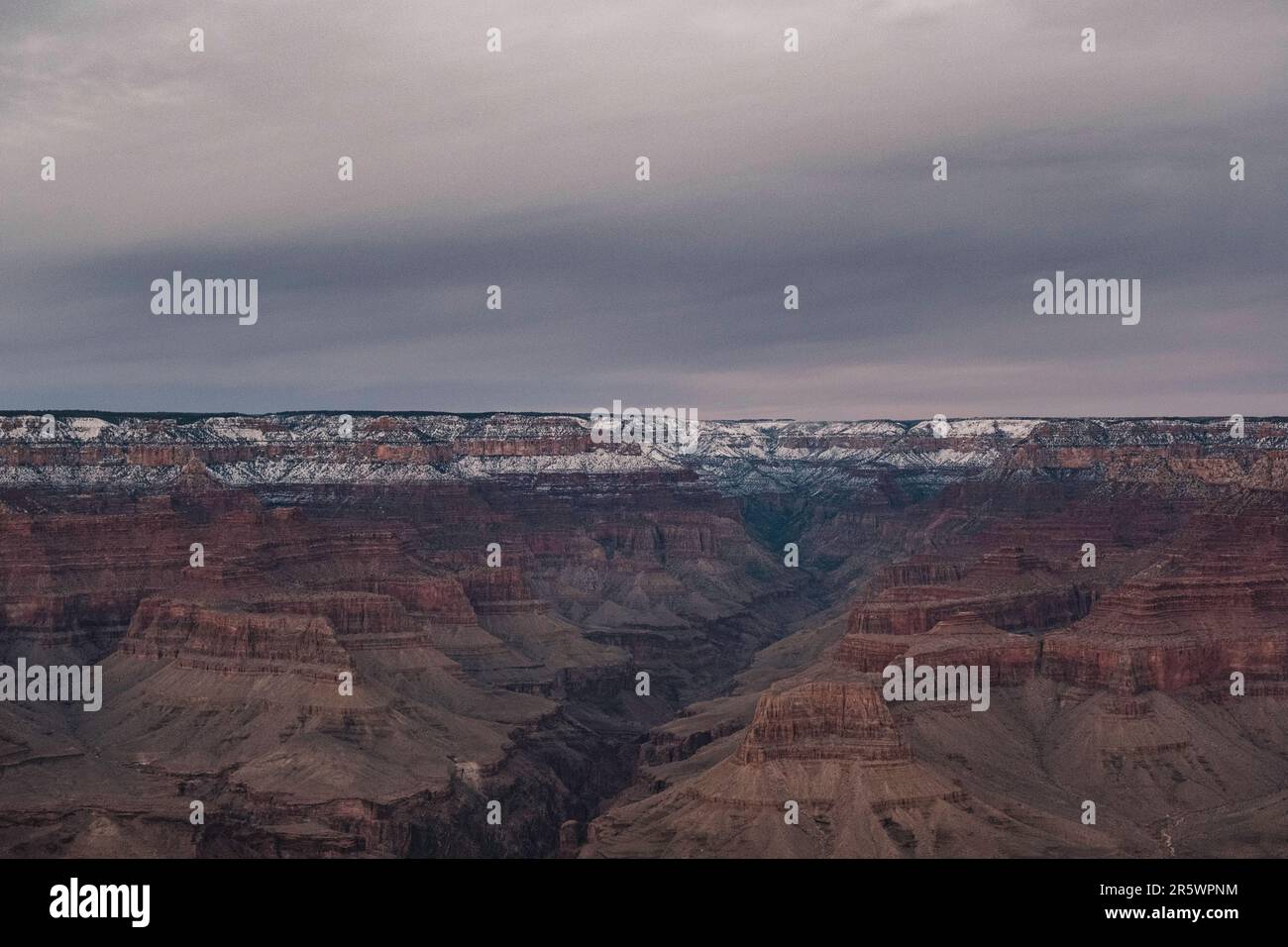 A breathtaking landscape featuring a large canyon surrounded by snow ...