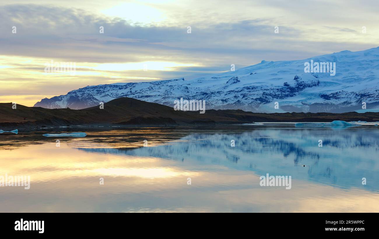 Frozen lake with mountains and spectacular snowy landscape, freezing ...