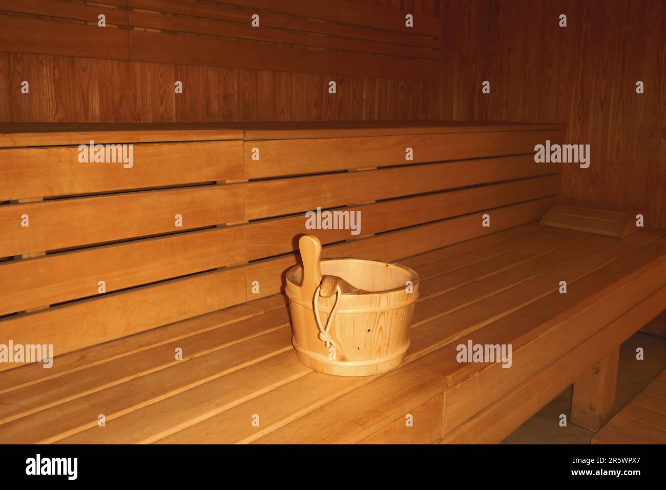 Wooden sauna interior wood fired sauna with bucket Stock Photo - Alamy